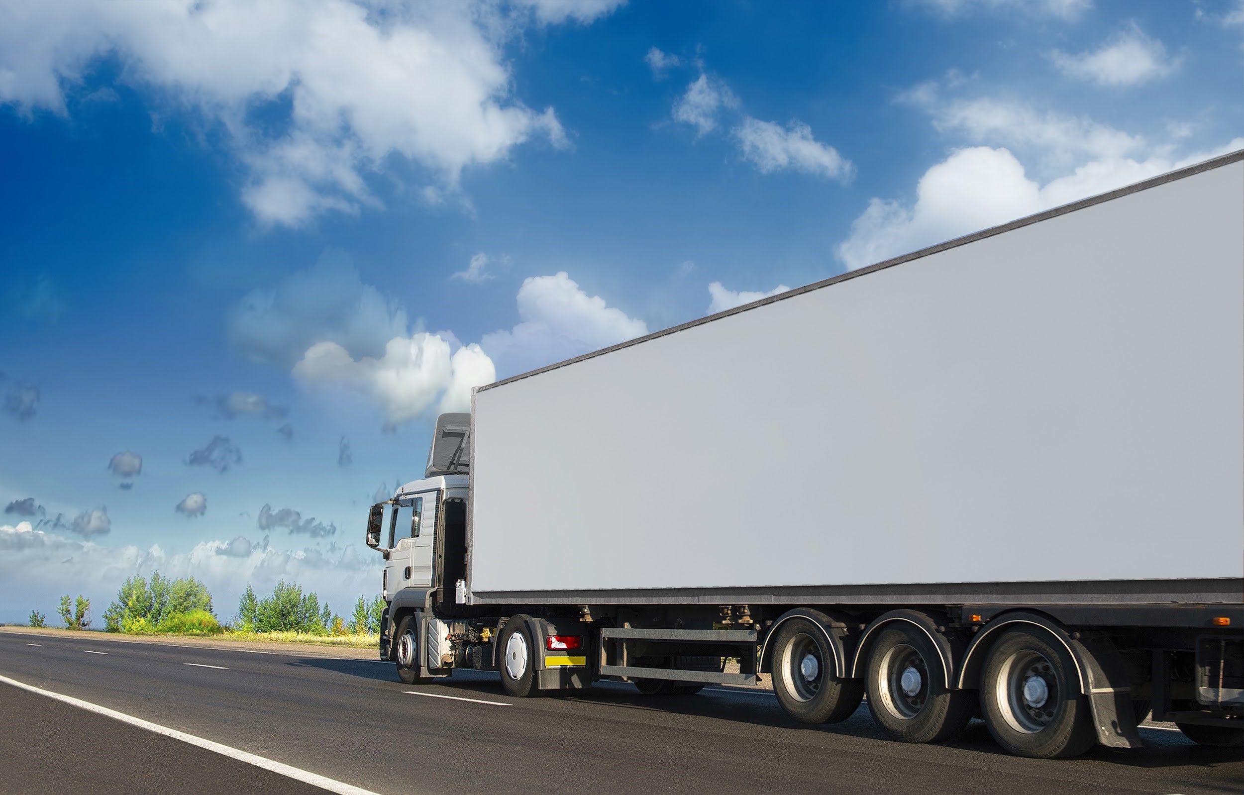 moving truck semi truck driving road